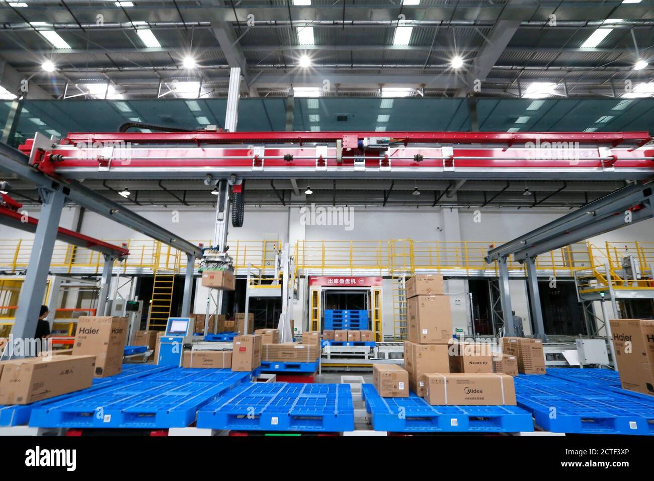 Large and bulky boxes are delivered at an unmanned smart warehouse ...