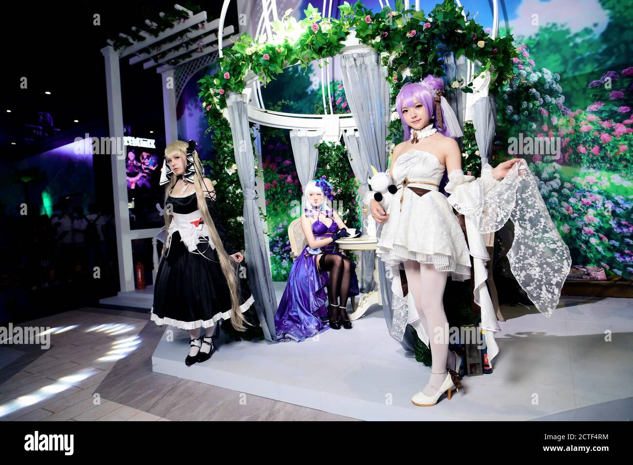 Cosplayers dress up as figures from animations, comics, and games ...