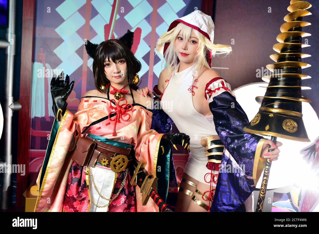 Cosplayers dress up as figures from animations, comics, and games ...