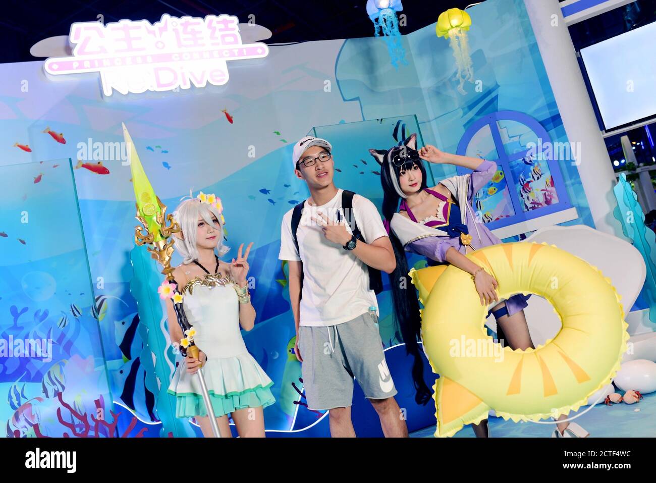 Cosplayers dress up as figures from animations, comics, and games ...