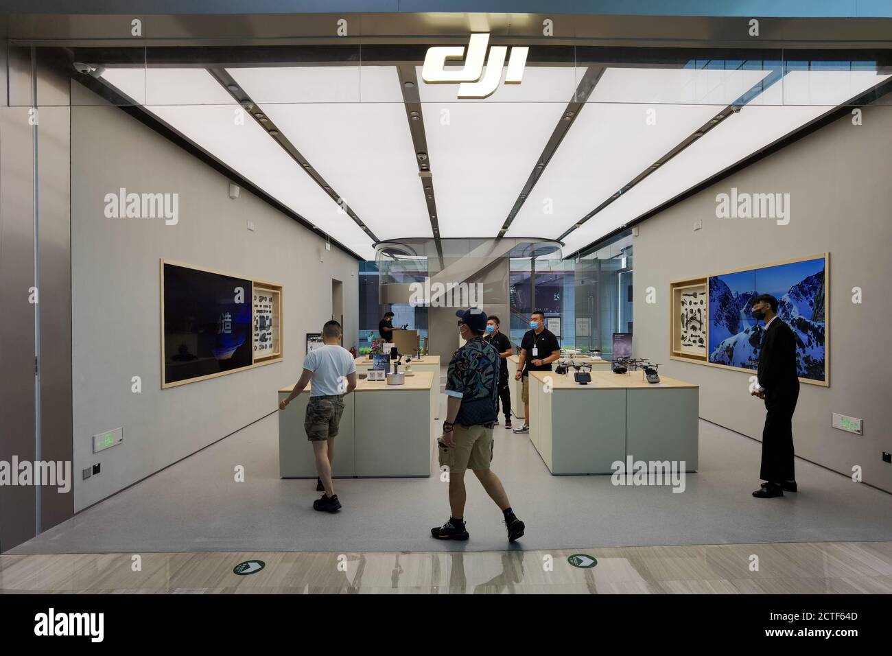 Customers experience products at the newly opened DJI flagship retail ...
