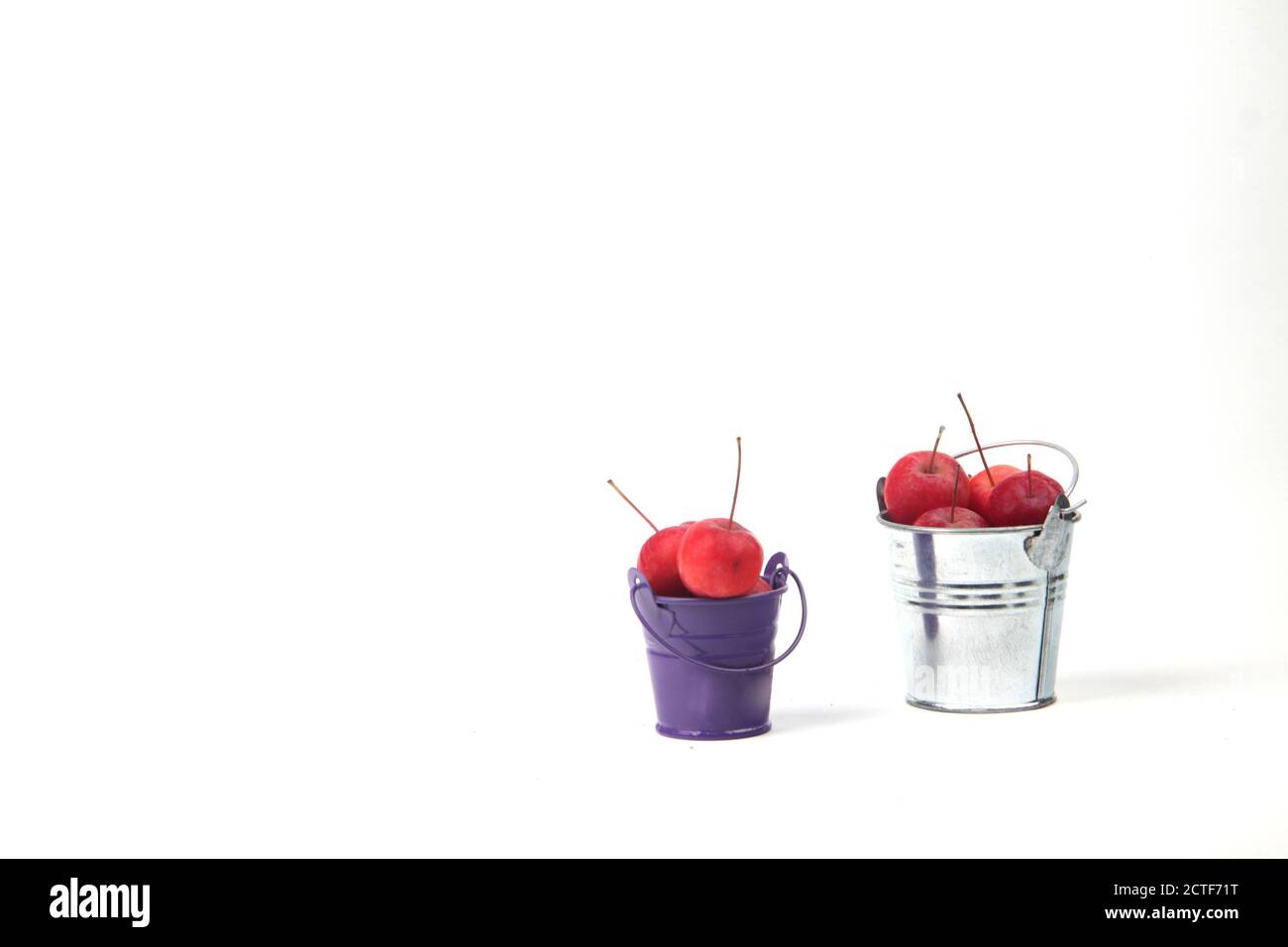 two buckets of apples isolated on white background. Autumn gardening ...
