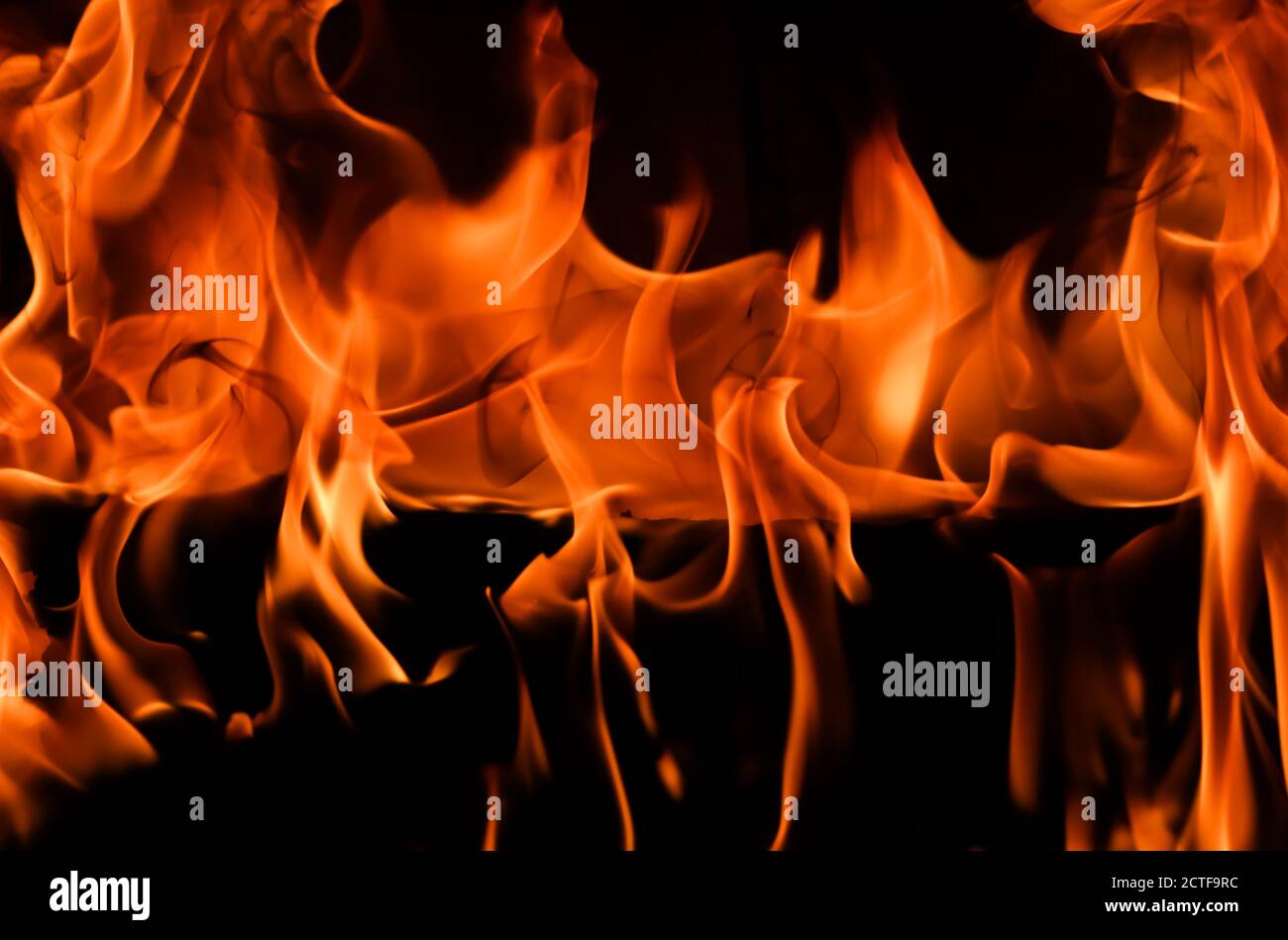 Red blaze Fire flame on a black background Stock Photo - Alamy