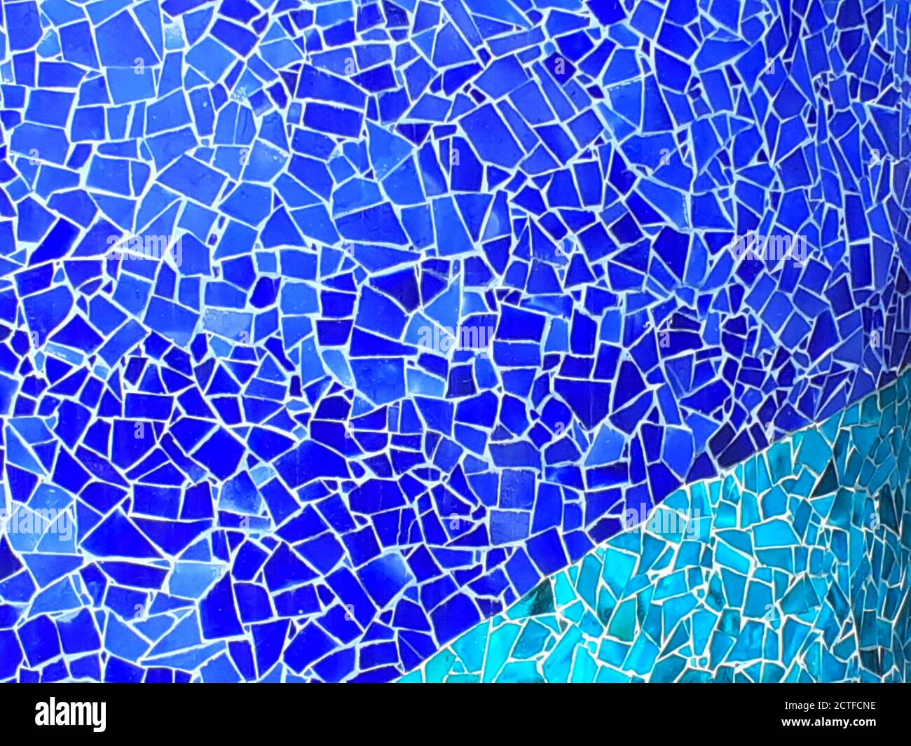 Wall of blue broken tiles mosaic Stock Photo - Alamy