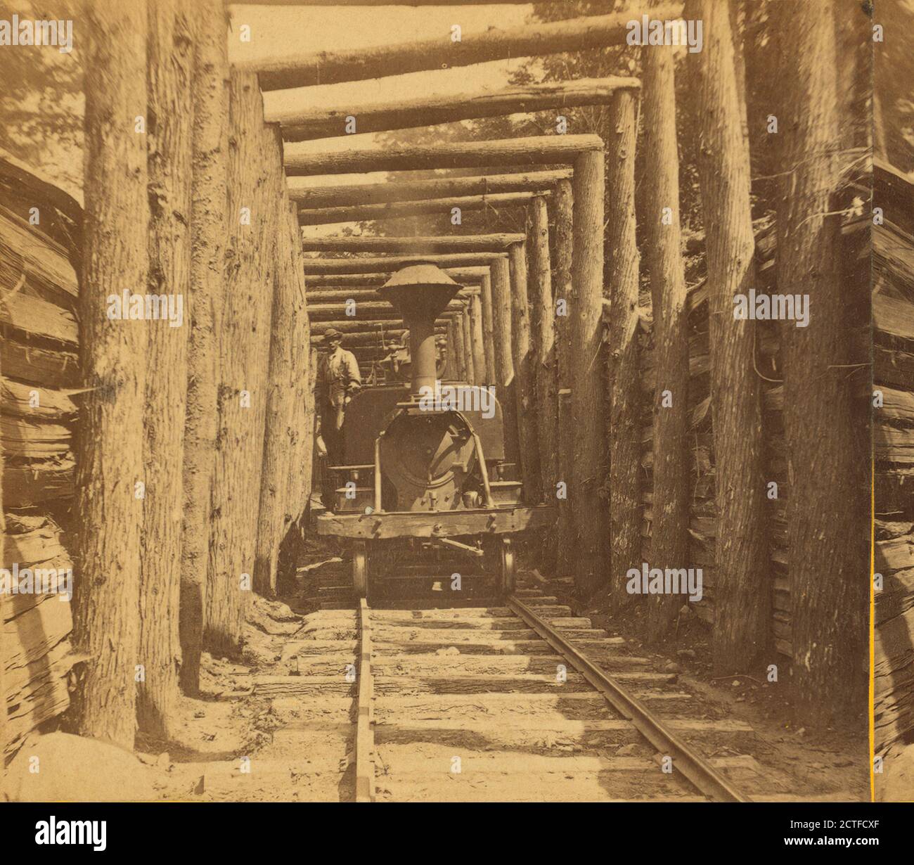 Locomotive in log snowshed corridor., Railroad locomotives, Logs ...