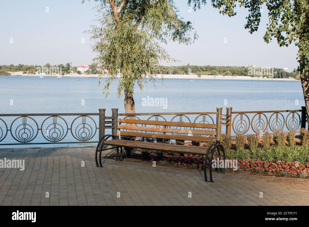 beautiful bench in park near the river Stock Photo - Alamy