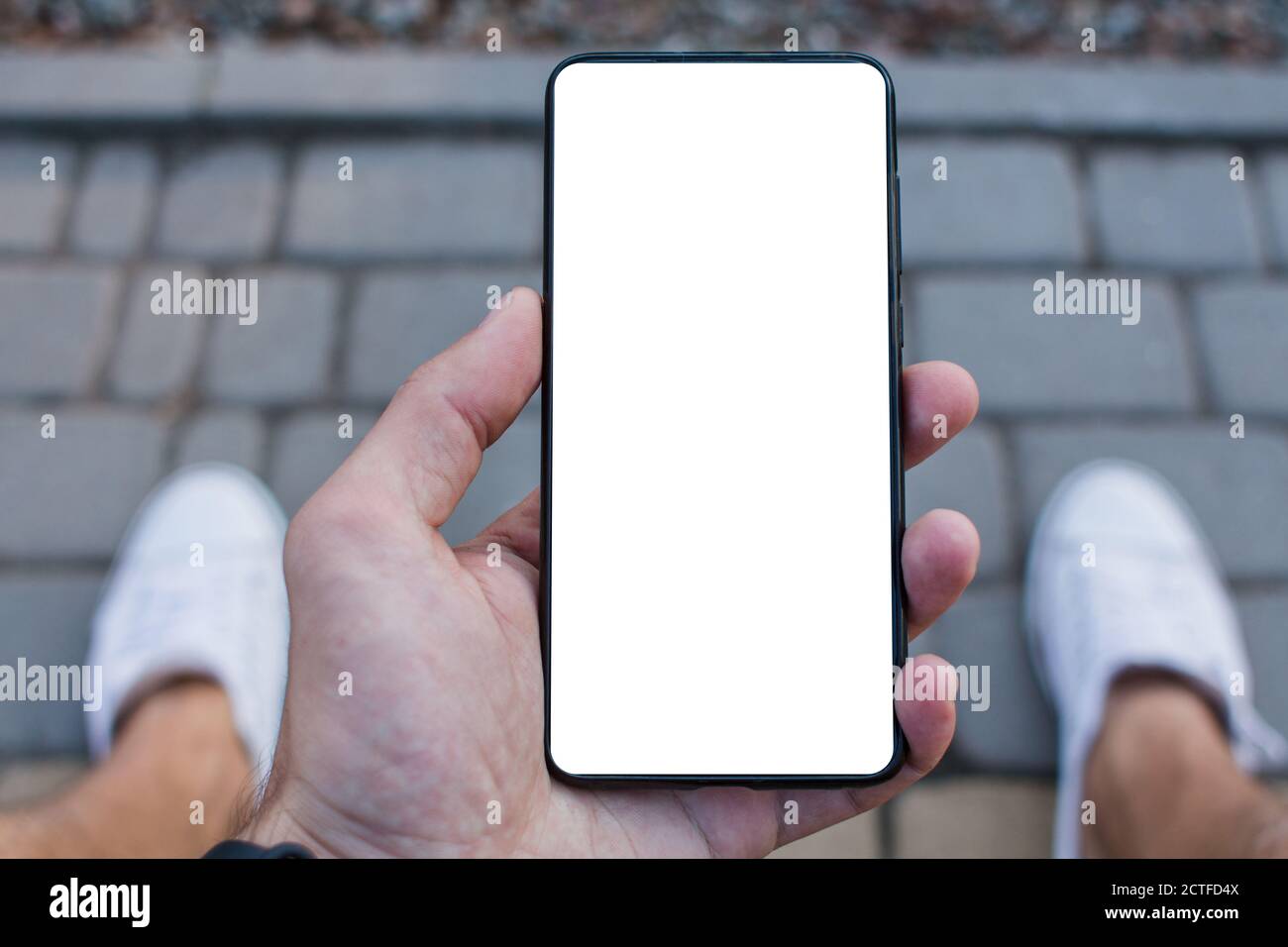 smartphone with a white screen in man's hand Stock Photo - Alamy
