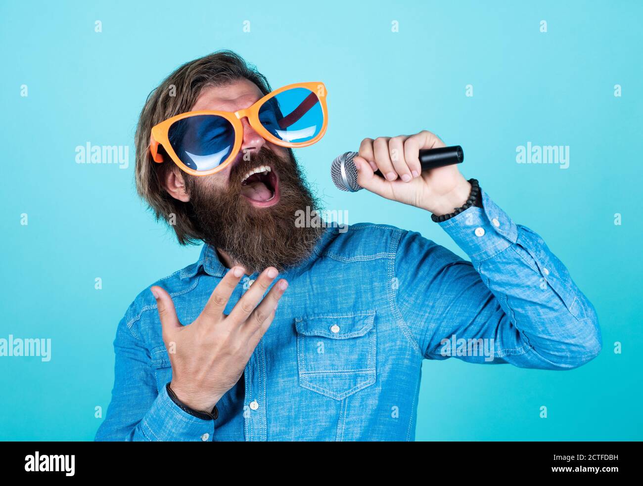 love is the music. male singer singing song in microphone. celebrate ...