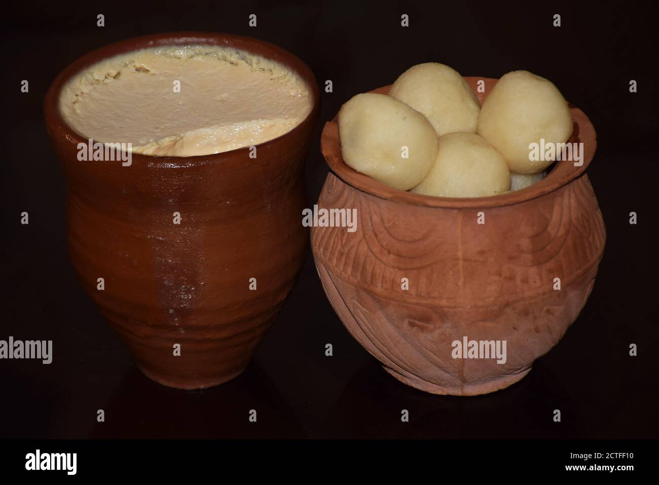 Traditional Indian Bengali Sweet Misti Doi (sweet Curd) with Rosogolla ...