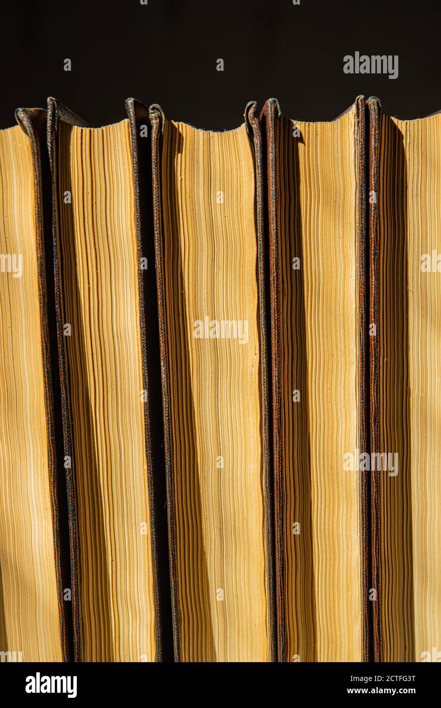 Stack of dusty books on white background hi-res stock photography and ...