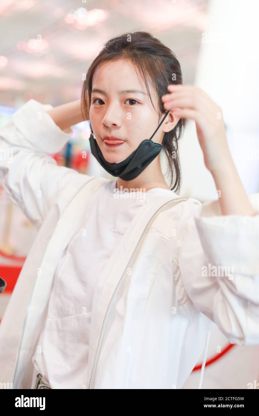 Chinese actress Li Gengxi arrives at a Beijing airport before departure in Beijing, China, 10 ...
