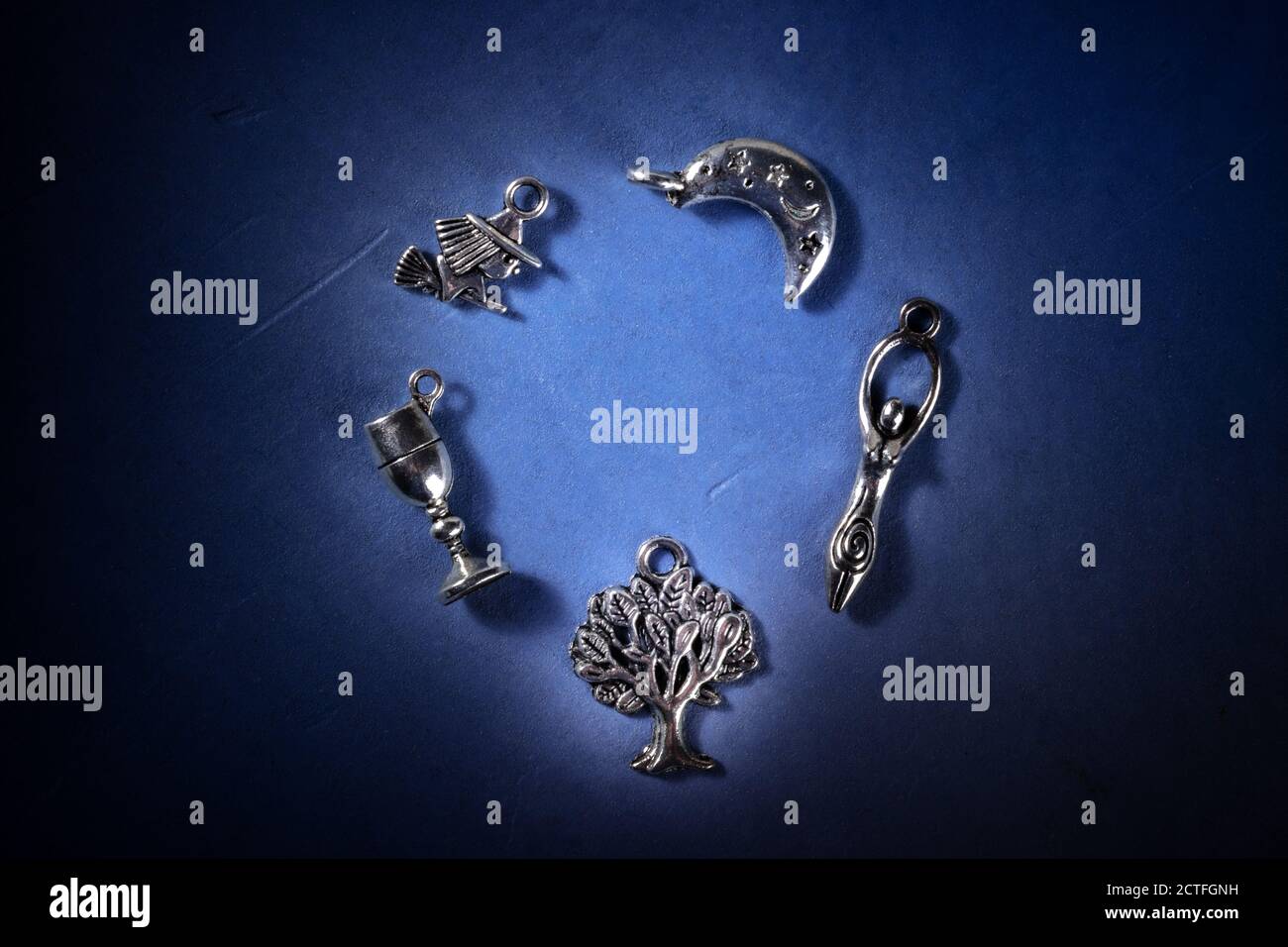 A frame with Wiccan symbols. Witch, Goddess, Moon, tree, chalice, a ...