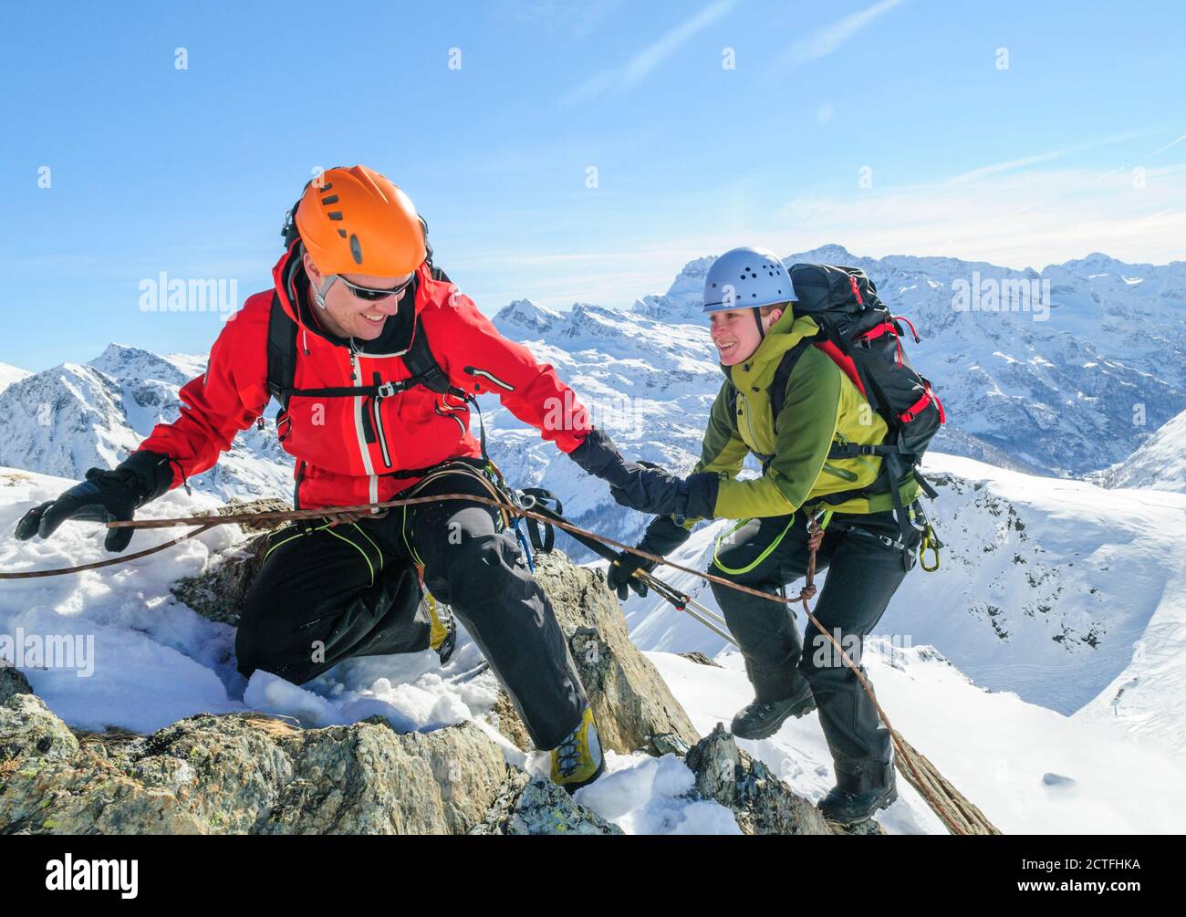 Teamwork in high alpine region near Gressoney in Italy Stock Photo - Alamy