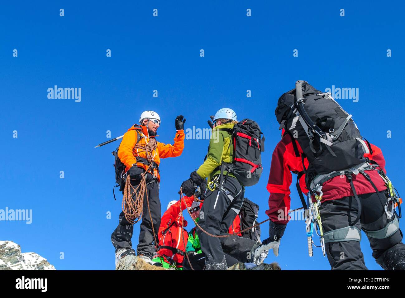 Adventurers on summit of a high alpine tour in Monte Rosa Stock Photo ...