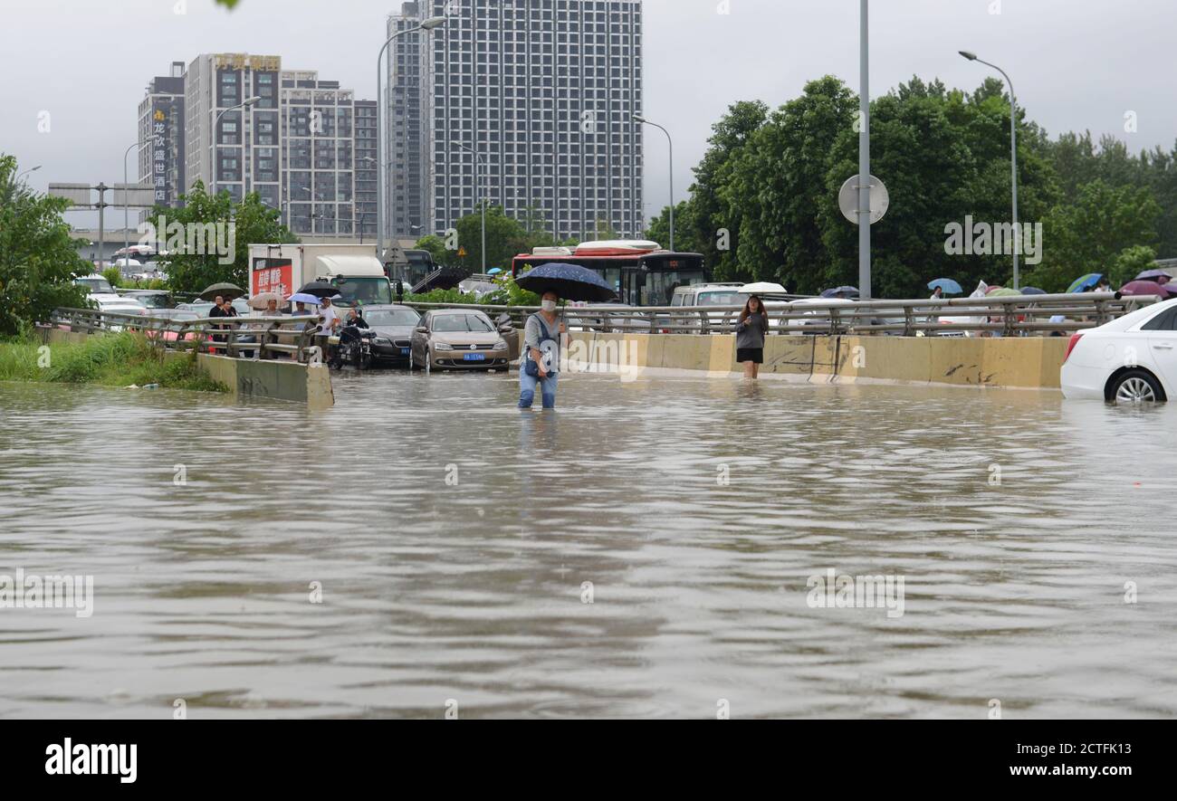 People travel through the city logging caused by heavy rainfall in ...