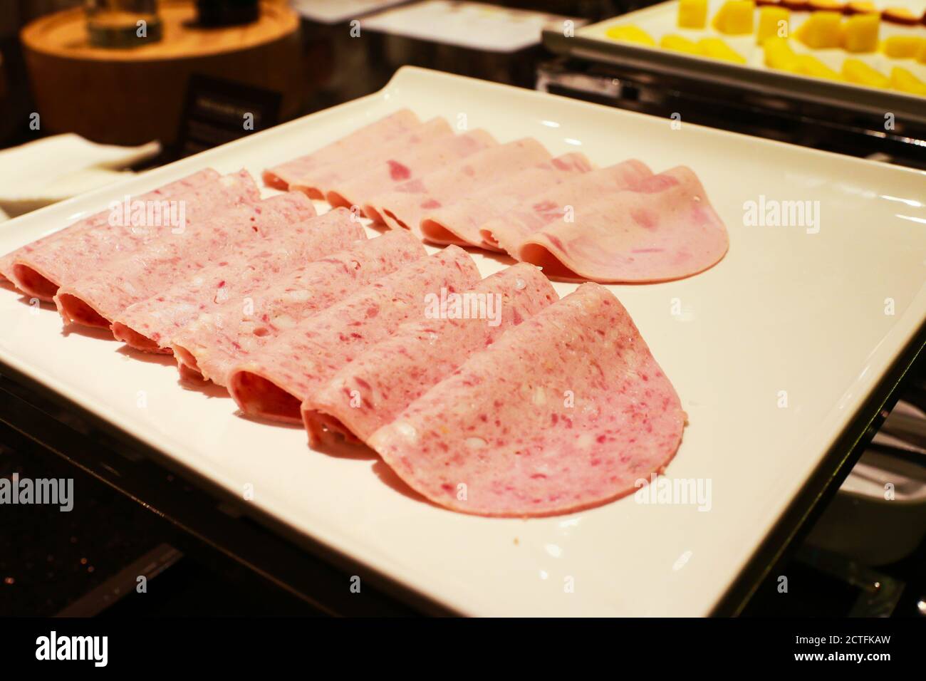 Slices of ham on a restaurant breakfast buffet Stock Photo - Alamy