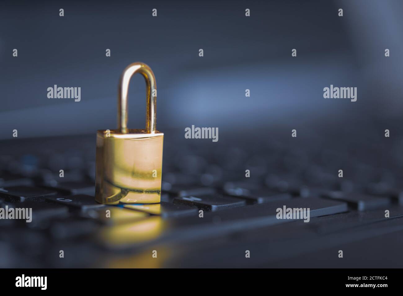 Background image of golden metal lock on keyboard, computer security ...