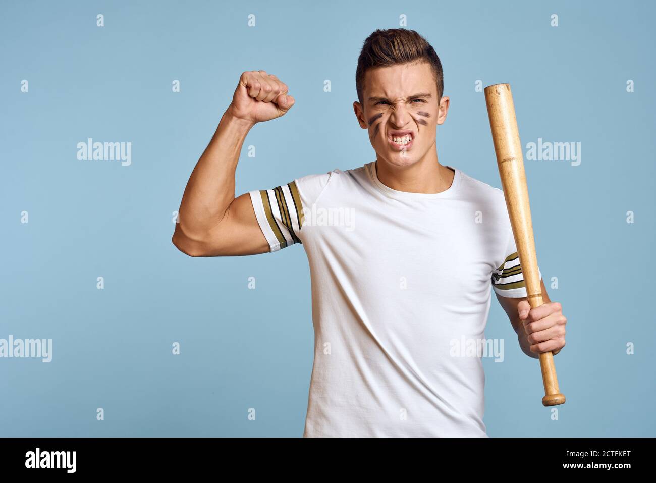 baseball guy with a bat in his hand on a blue background and a combat ...