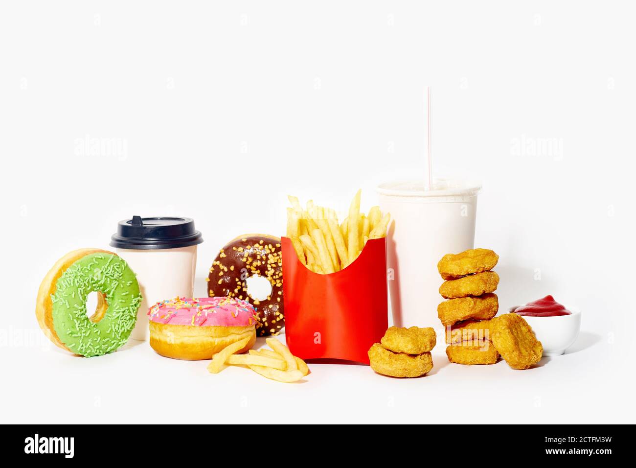 Junk food meal on white background. French fries, chicken nuggets ...
