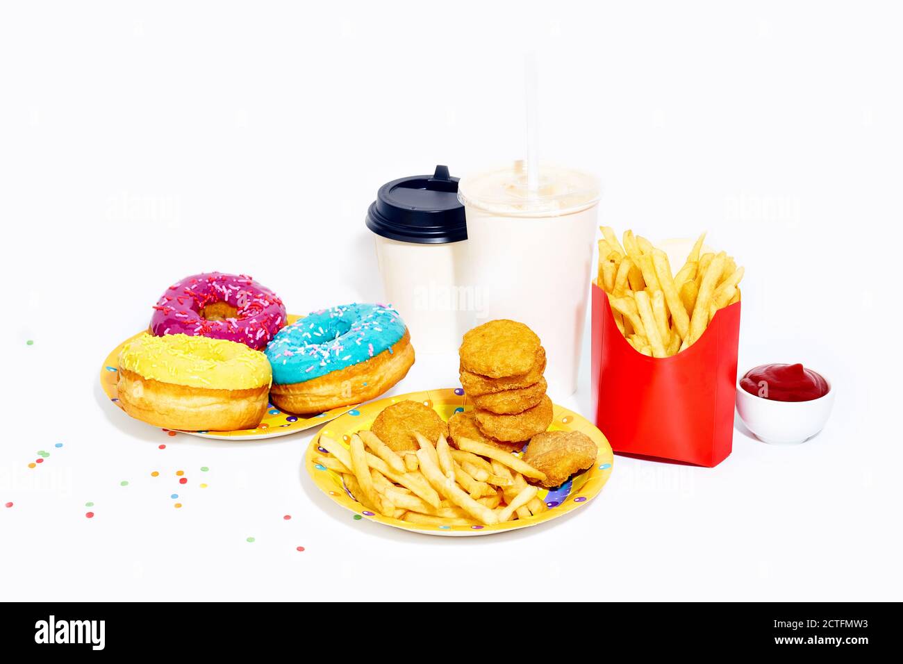 Junk food meal on white background. French fries, chicken nuggets ...