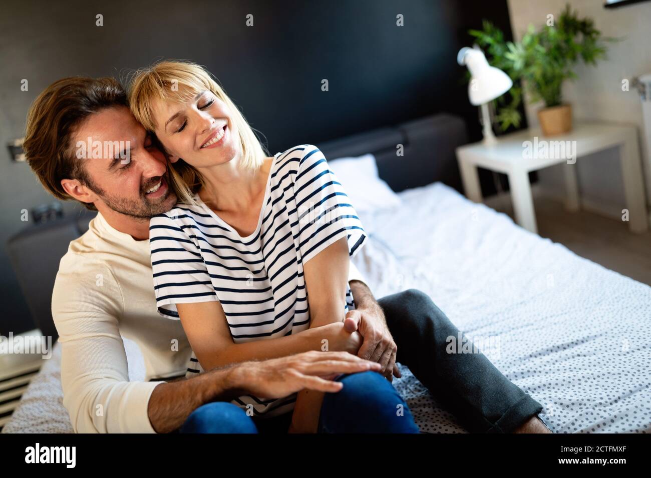 Couple in love hugging and bonding with true emotions at home Stock ...