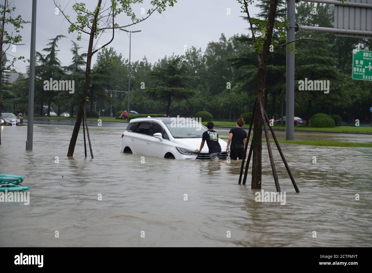 A car is submerged by the city logging caused by heavy rainfall in ...