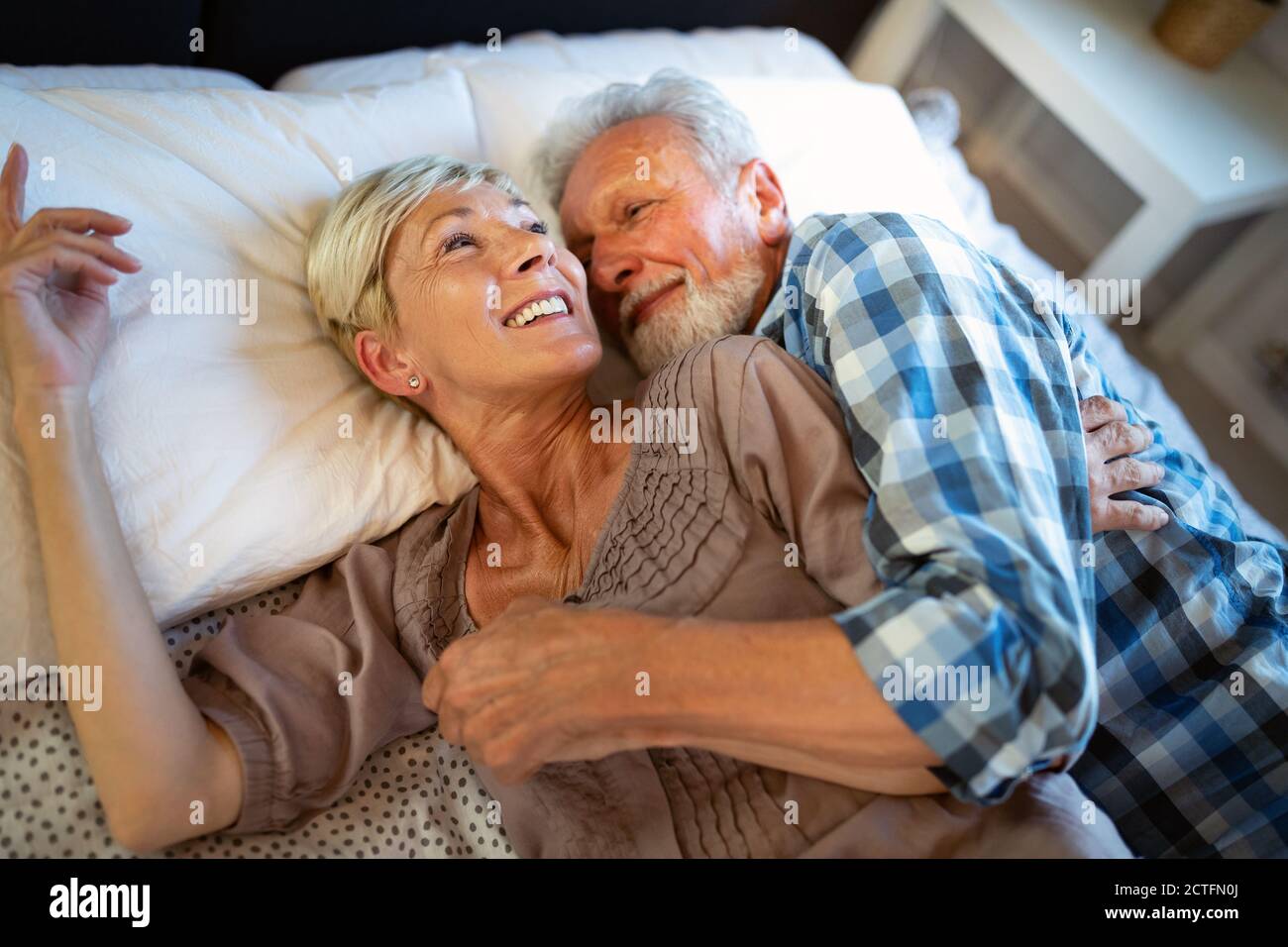 Happy Senior Couple In Love Hugging And Bonding With True Emotions At