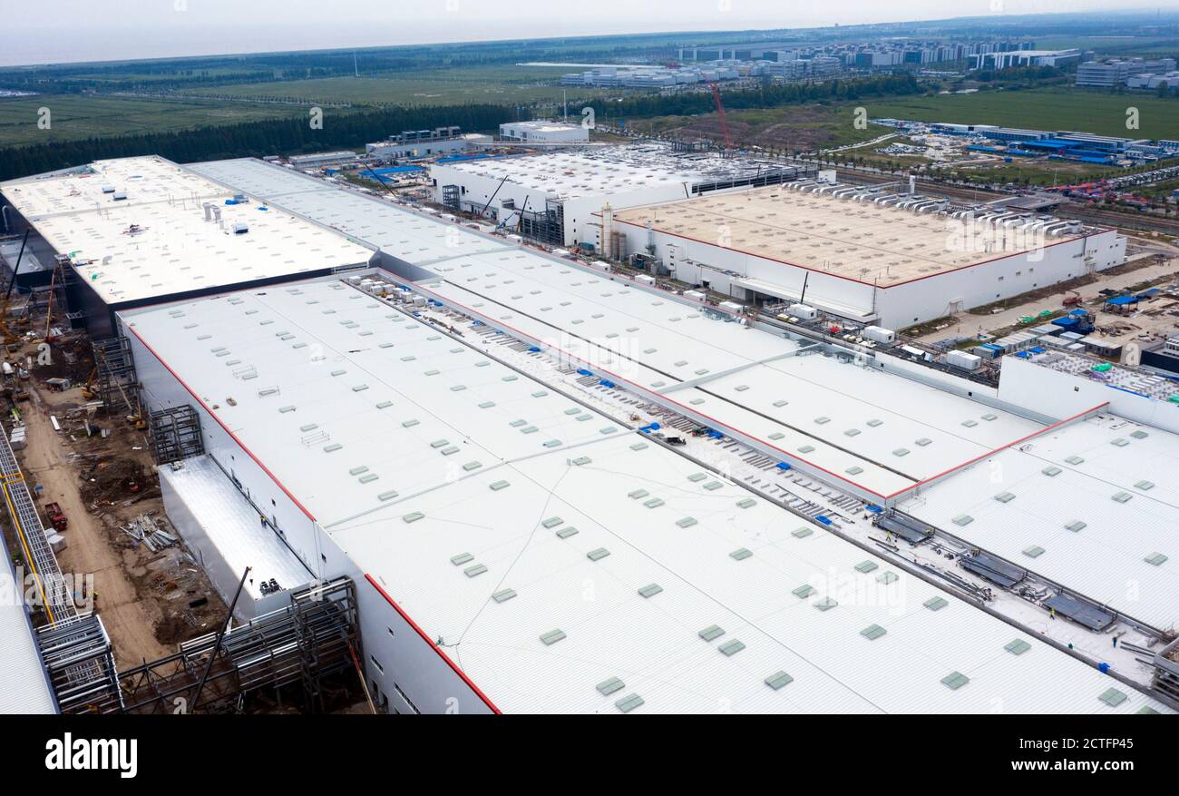 An aerial view of workers, with help of cranes and other construction ...