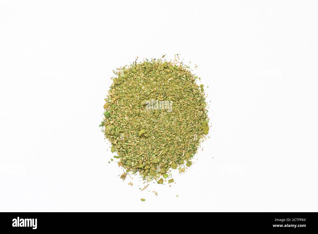 green spice on white background. Dried and ground herbs Stock Photo - Alamy