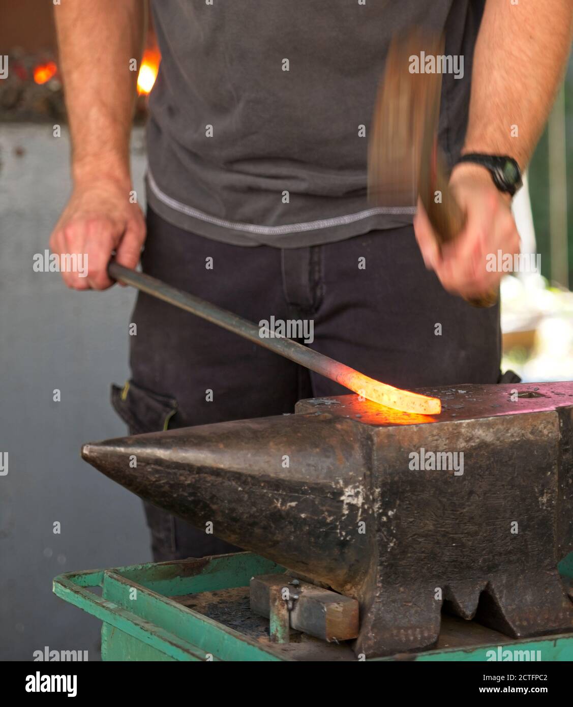 Blacksmith tools and actions forging iron objects Stock Photo - Alamy