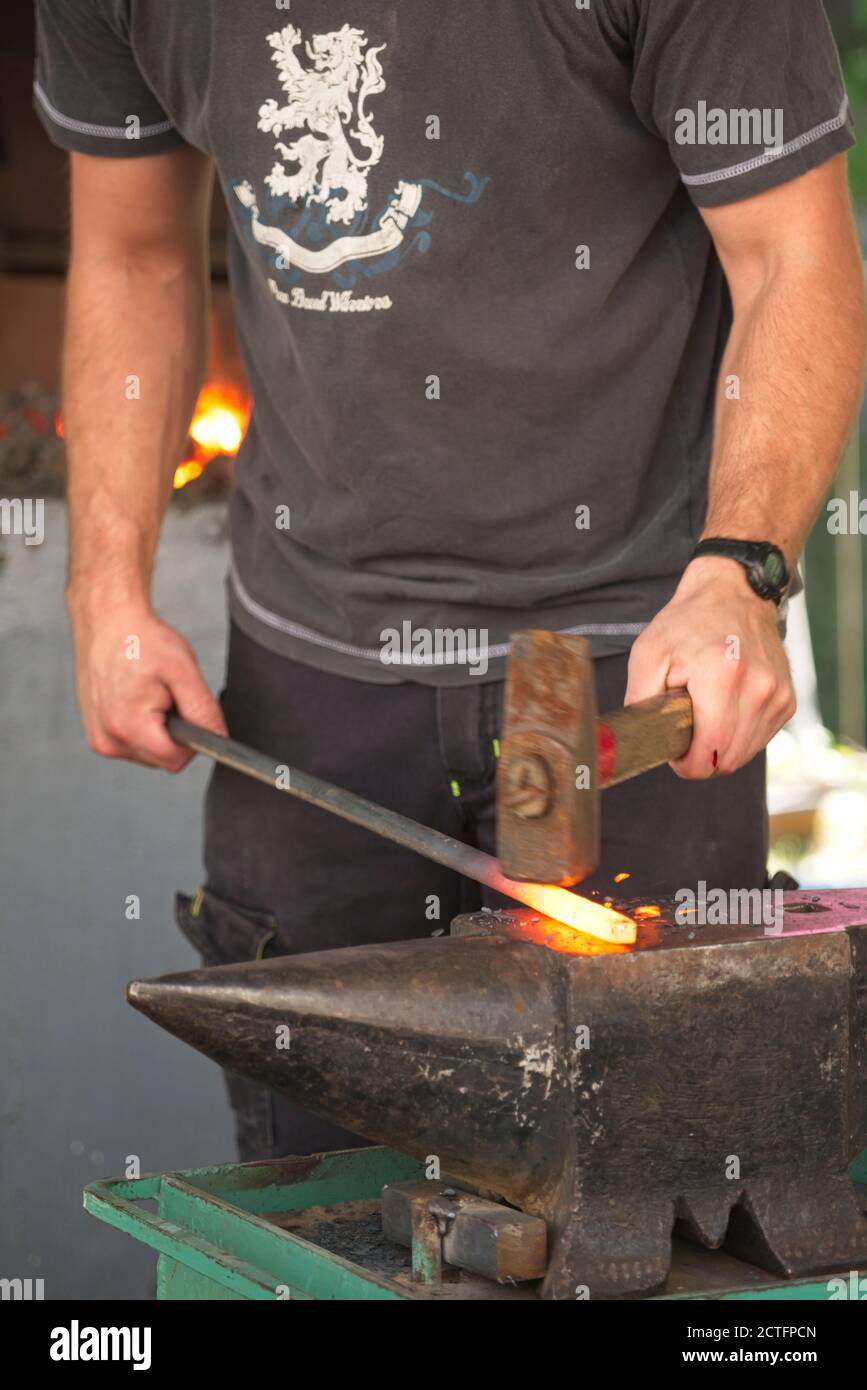 Blacksmith tools and actions forging iron objects Stock Photo - Alamy