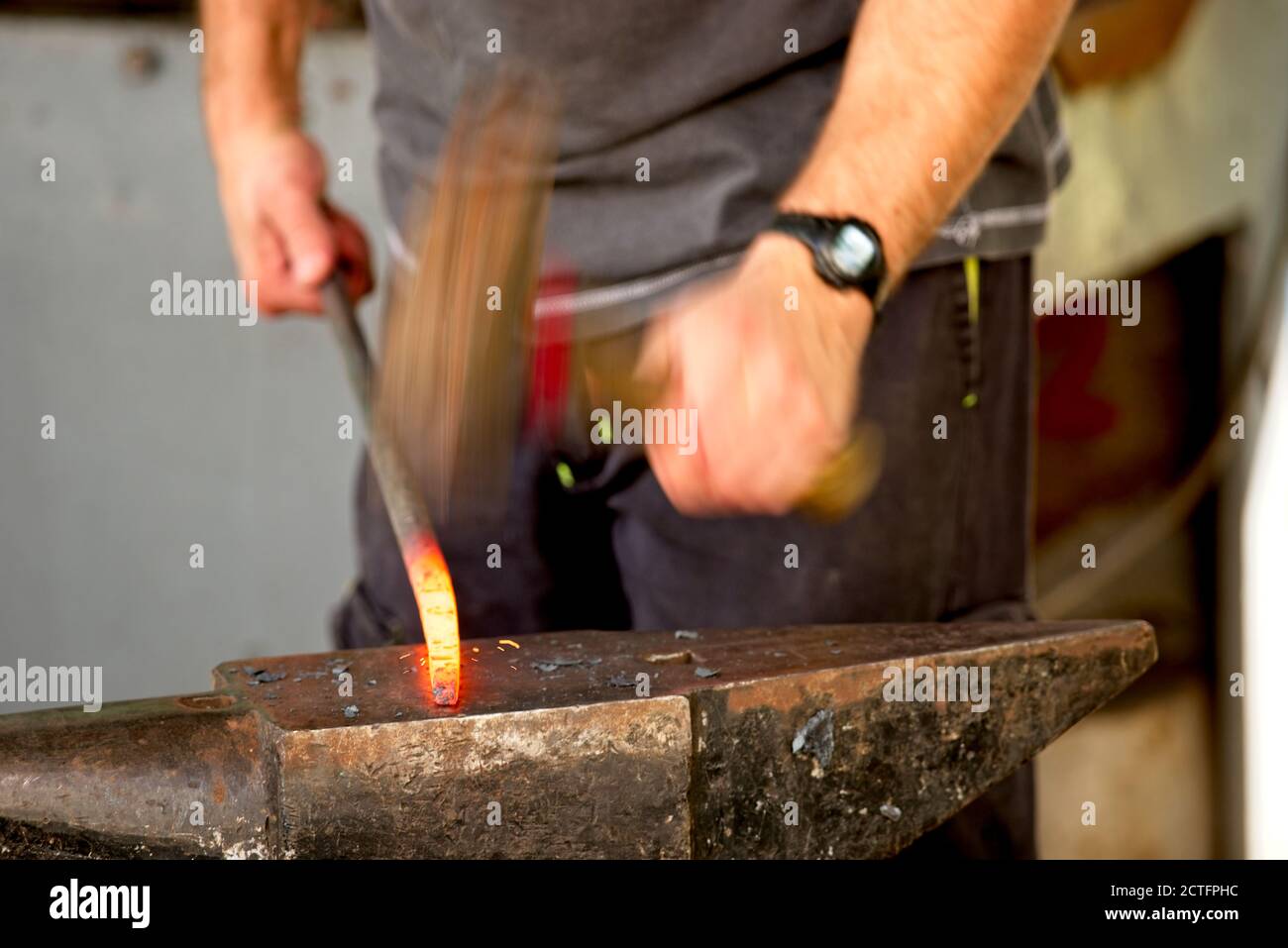 Blacksmith tools and actions forging iron objects Stock Photo - Alamy