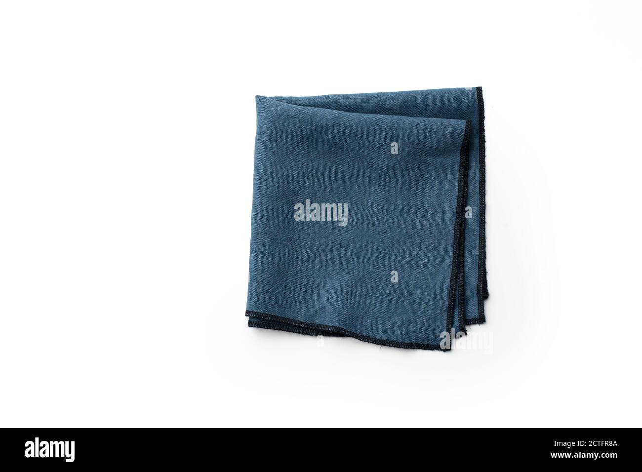 Flat lay with blue linen kitchen napkin isolated on white background ...