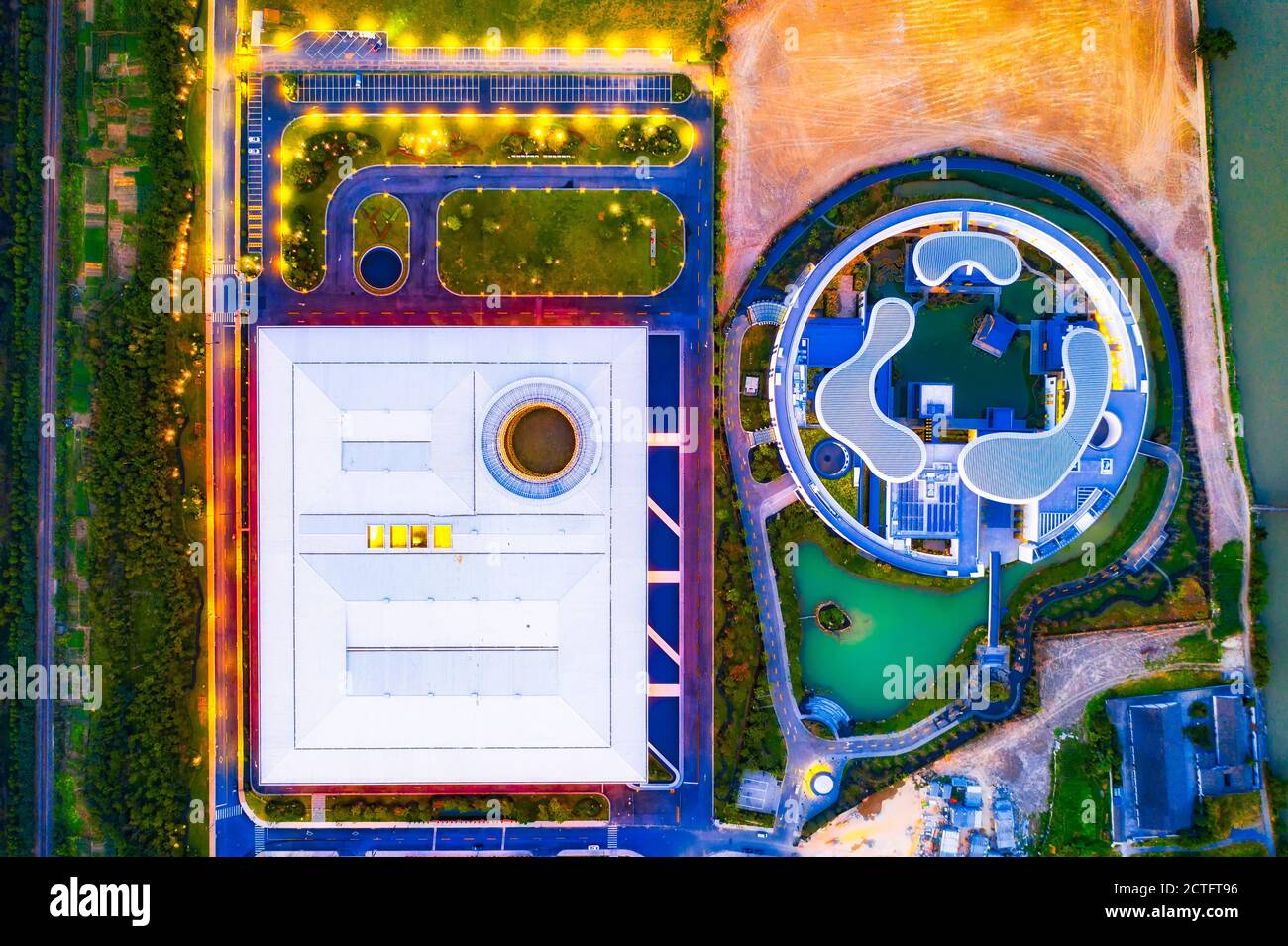 An aerial view of edifices with lights on standing in the Dream Town ...