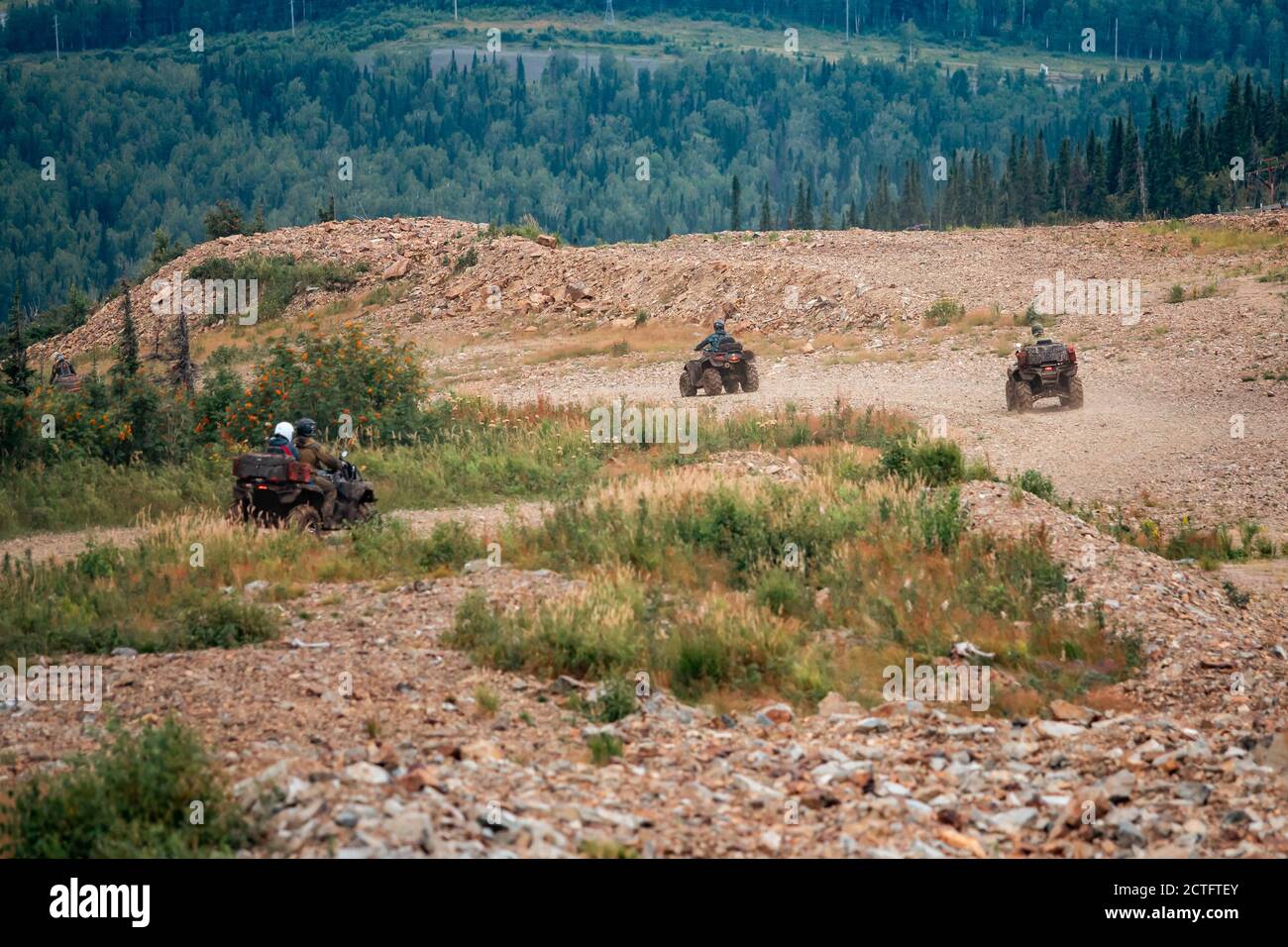 ATV bike group rides through forest off-road in trip summer Stock Photo ...