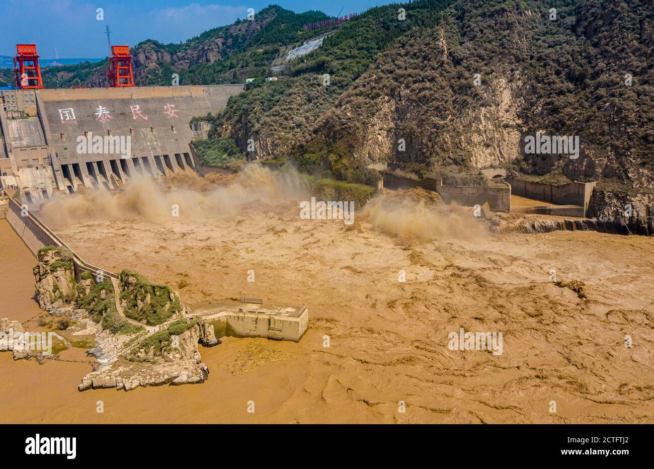 Aerial view of Sanmenxia Dam discharging water due to the flood peak at ...