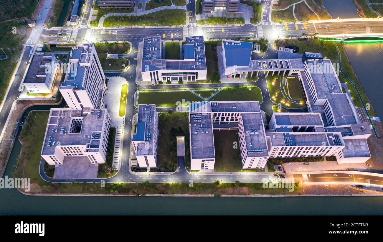 An aerial view of edifices with lights on standing in the Dream Town ...