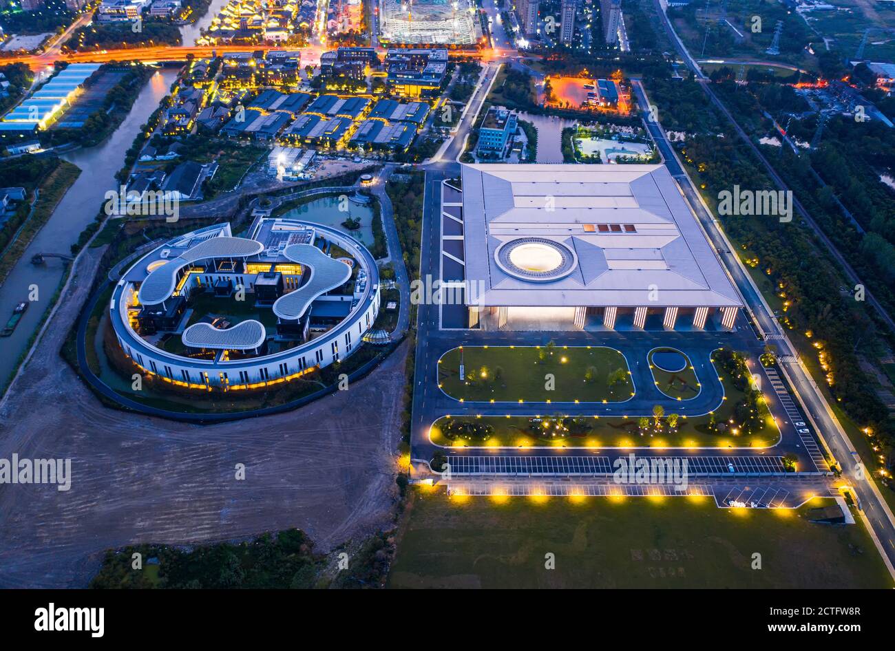 An aerial view of edifices with lights on standing in the Dream Town ...