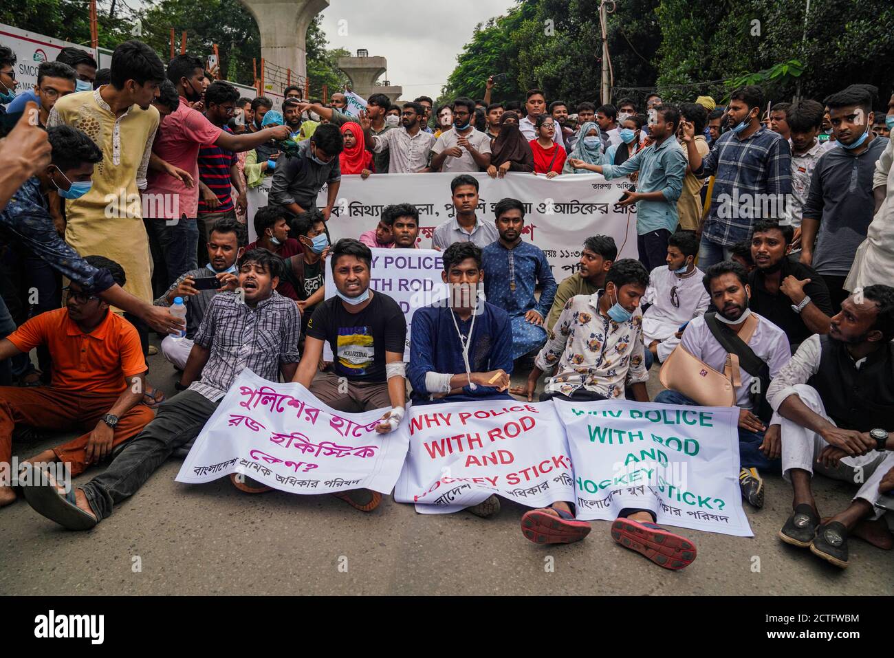 Dhaka, Bangladesh. 22nd Sep, 2020. Protesters hold a banner and ...