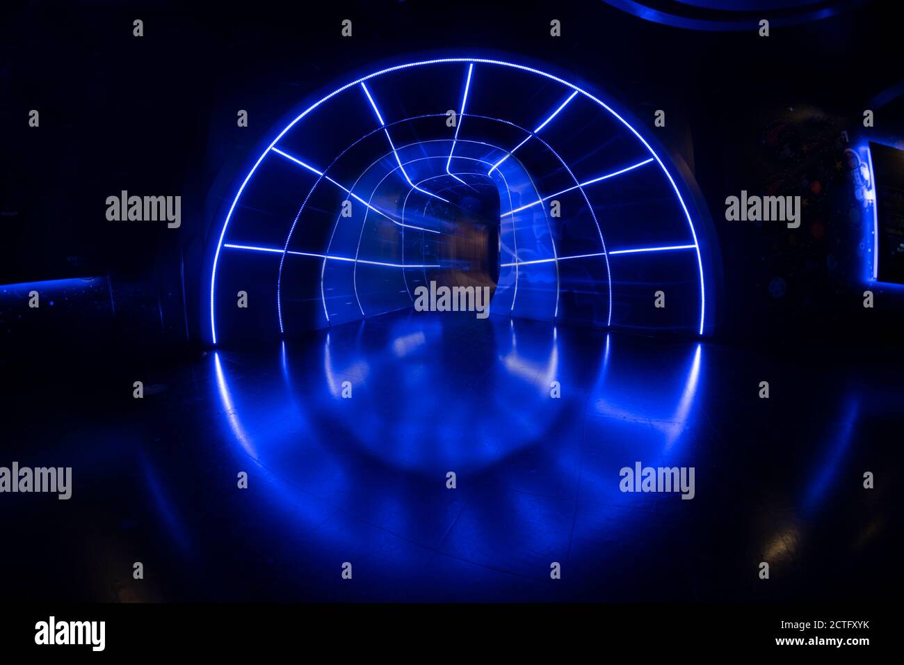 Blue neon light tunnel Stock Photo - Alamy