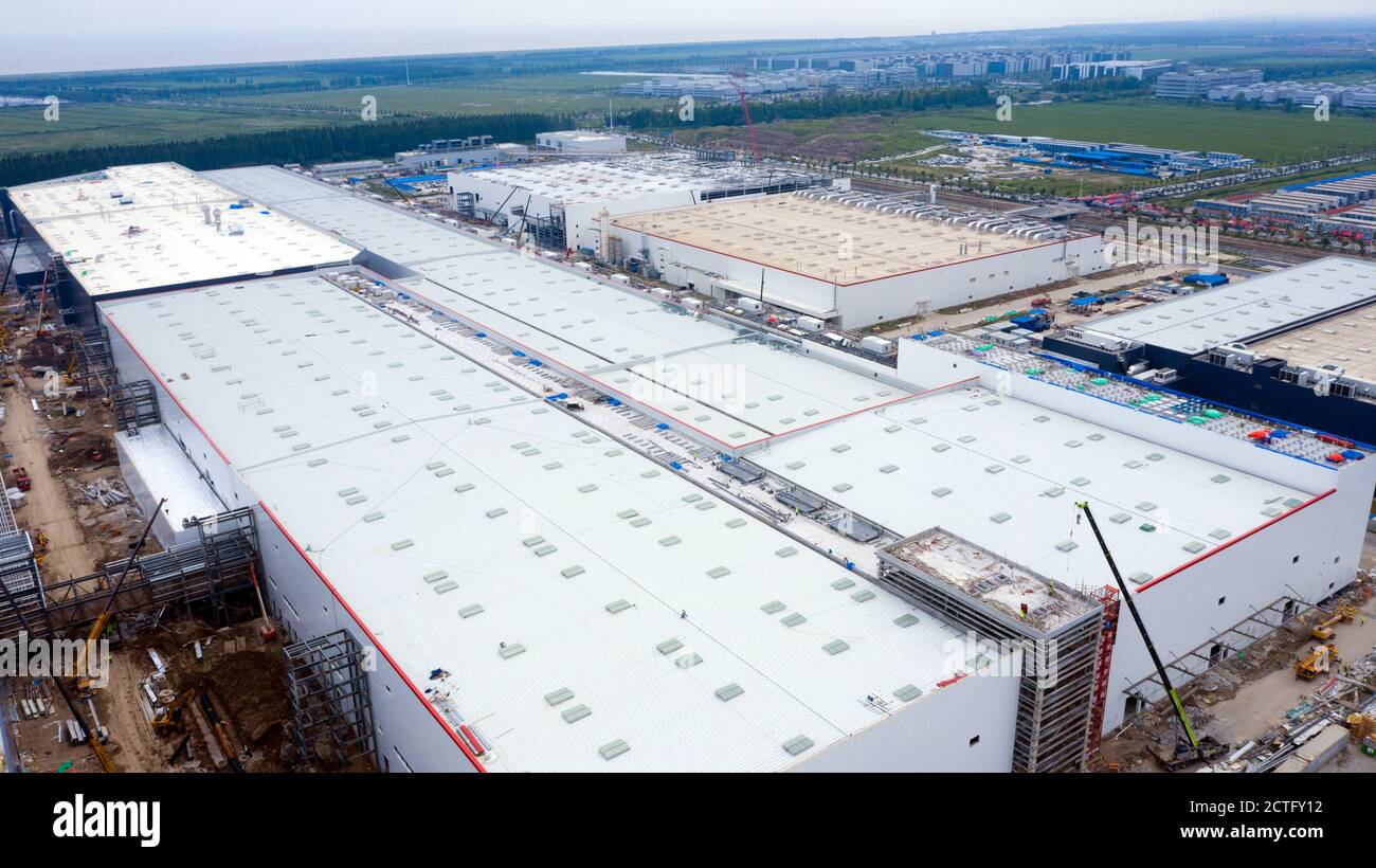 An aerial view of workers, with help of cranes and other construction ...
