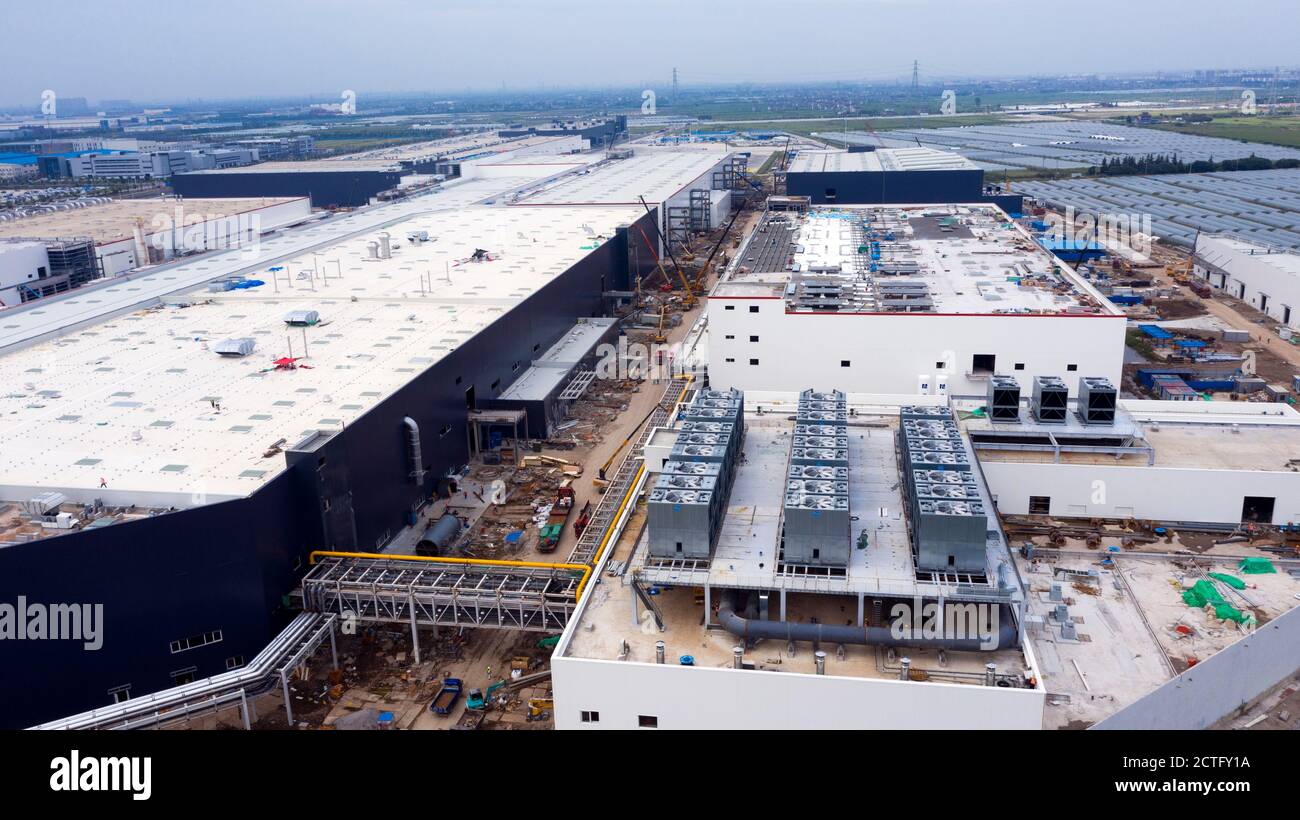 An aerial view of workers, with help of cranes and other construction ...