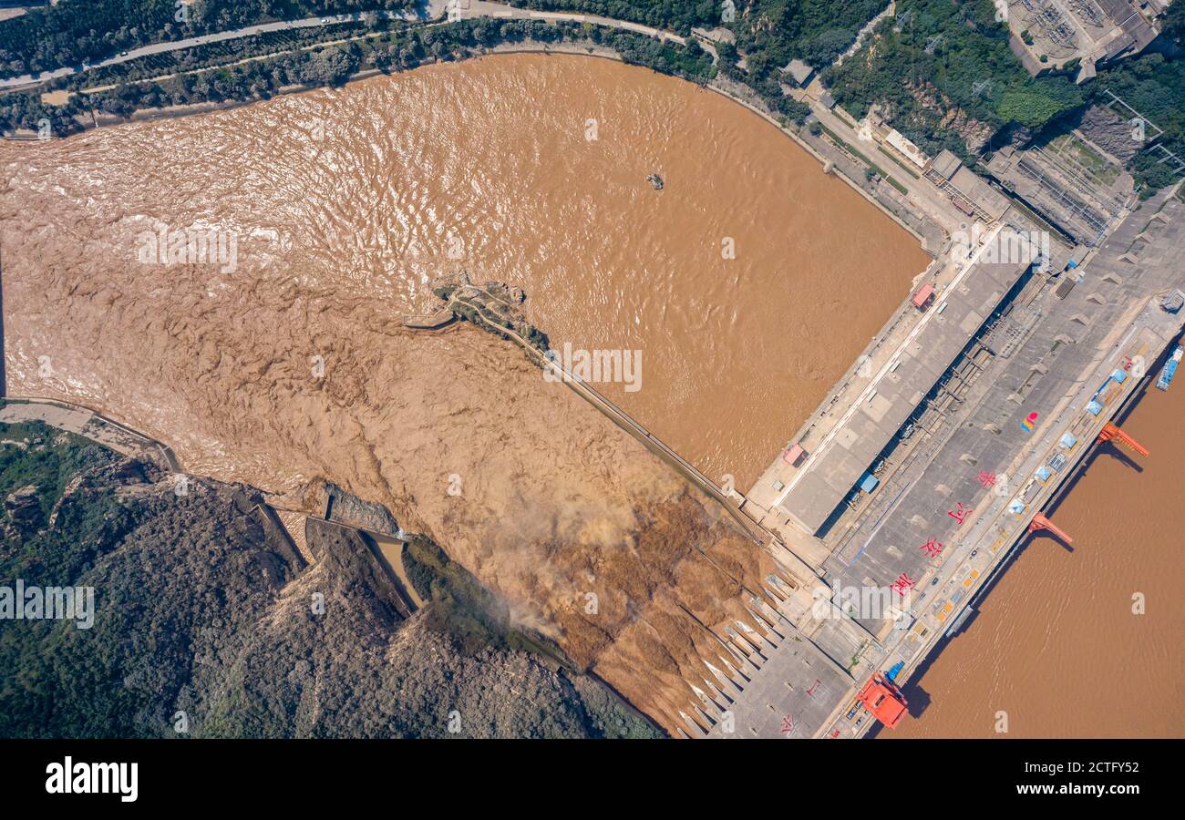 Aerial view of Sanmenxia Dam discharging water due to the flood peak at ...
