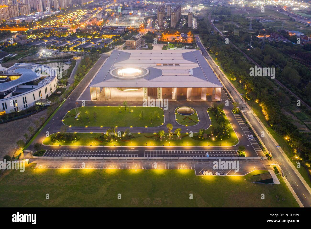 An aerial view of edifices with lights on standing in the Dream Town ...