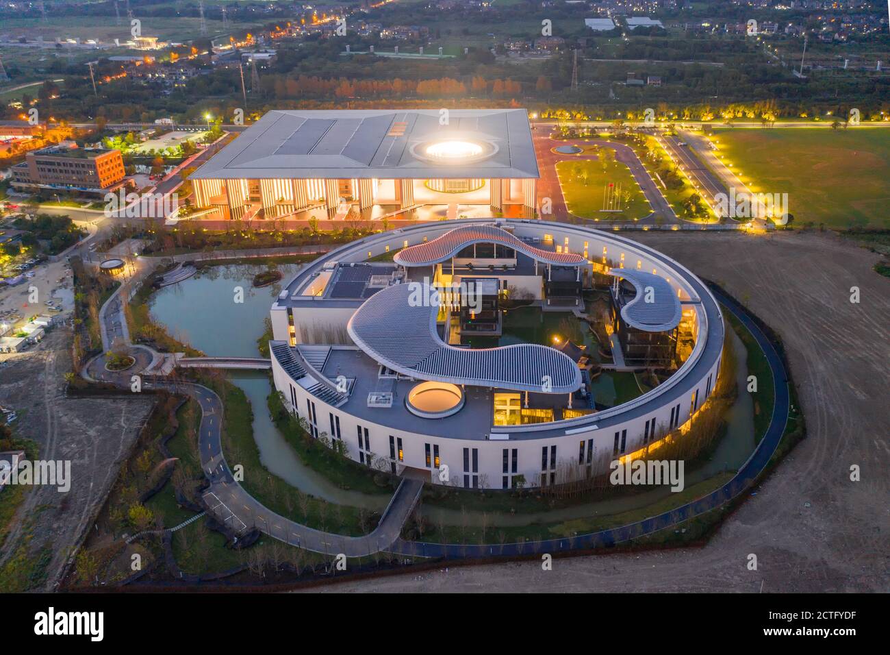 An aerial view of edifices with lights on standing in the Dream Town ...
