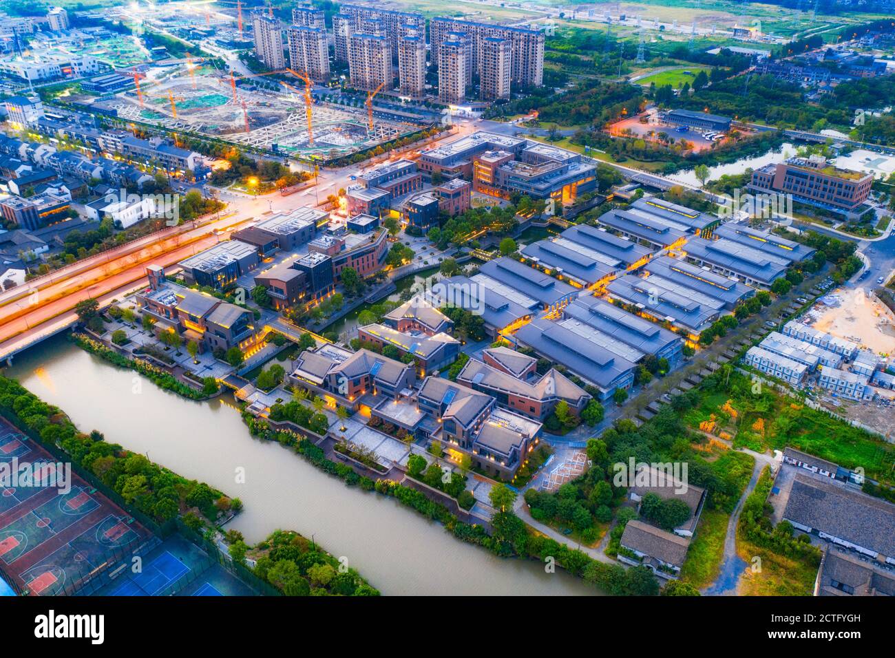 An aerial view of edifices with lights on standing in the Dream Town ...