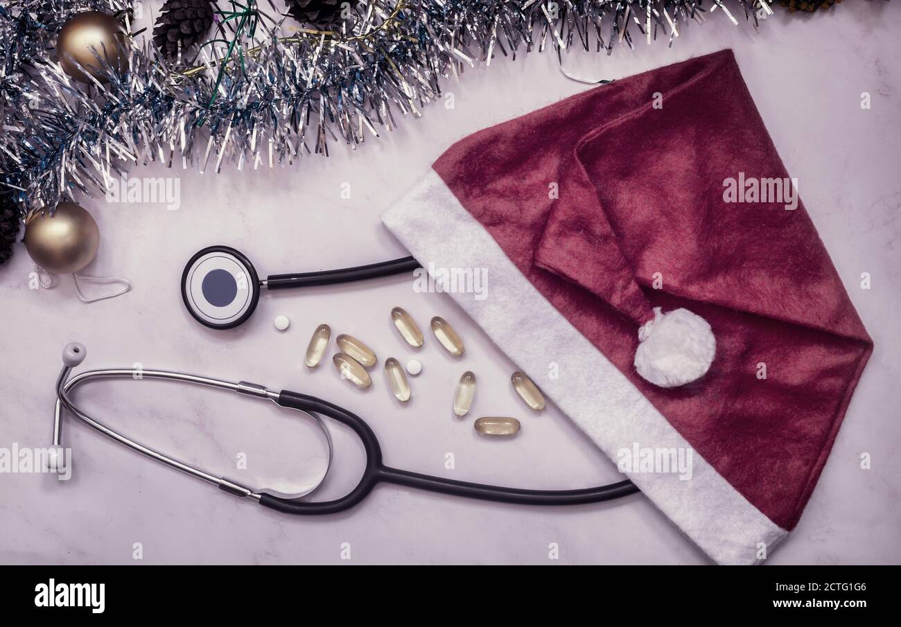 Christmas in medicine: stethoscope, pills and Christmas decorations ...