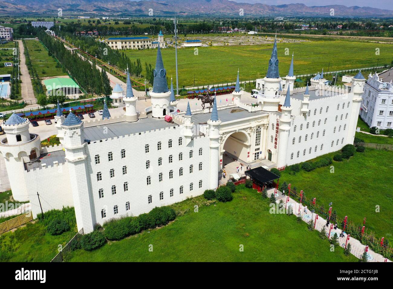 Aerial view of a European style castle by Lake Dai in Ulanqab city ...