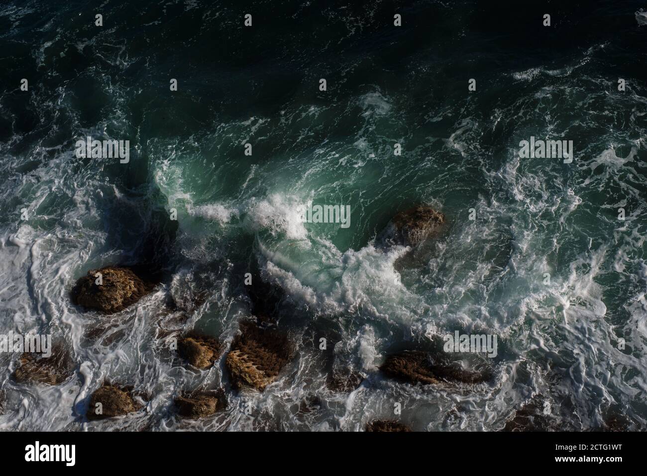 Ocean wave background breaking sea water rocky shore rough seas ...
