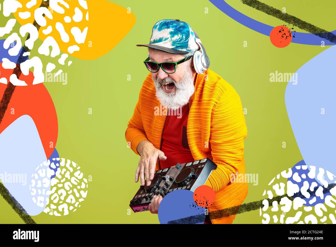 Forever young. Portrait of senior hipster man using devices, gadgets ...